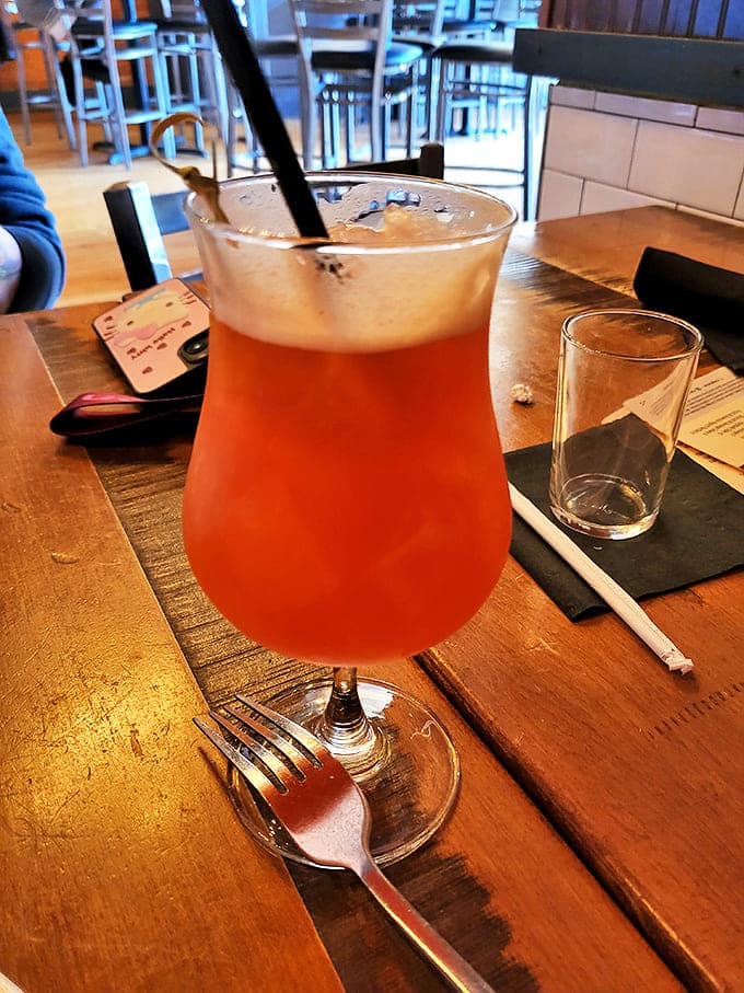 Sunset in a glass! This vibrant concoction promises vacation vibes with every sip, even if your only travel plans involve the drive home.