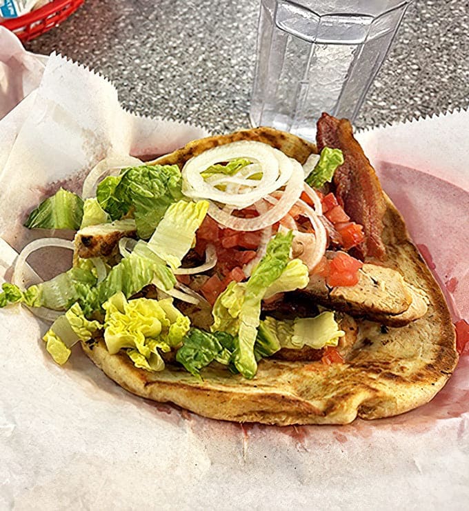 Fresh ingredients elevate the chicken pita beyond fast food territory &ndash; crisp vegetables and tender meat wrapped in warm, pillowy bread.