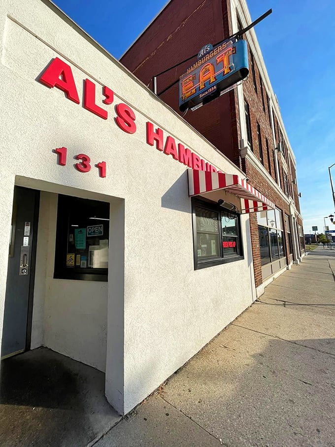 Al's iconic exterior with its vintage "EAT" sign &ndash; a beacon of burger excellence that's been guiding hungry patrons to this spot for decades.