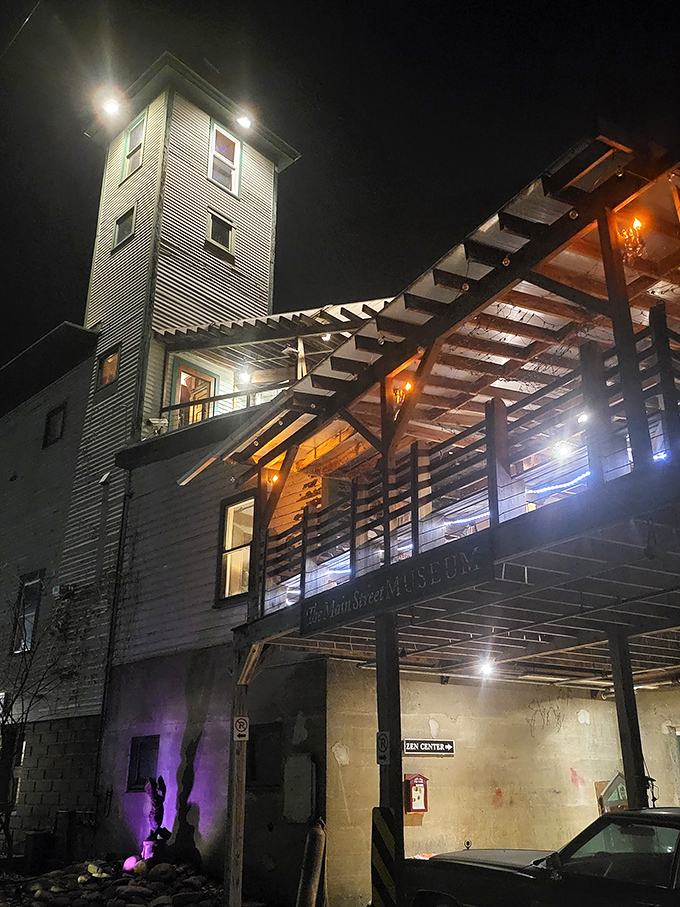 As night falls, the illuminated museum takes on an almost magical quality, its windows glowing with the promise of wonders within.