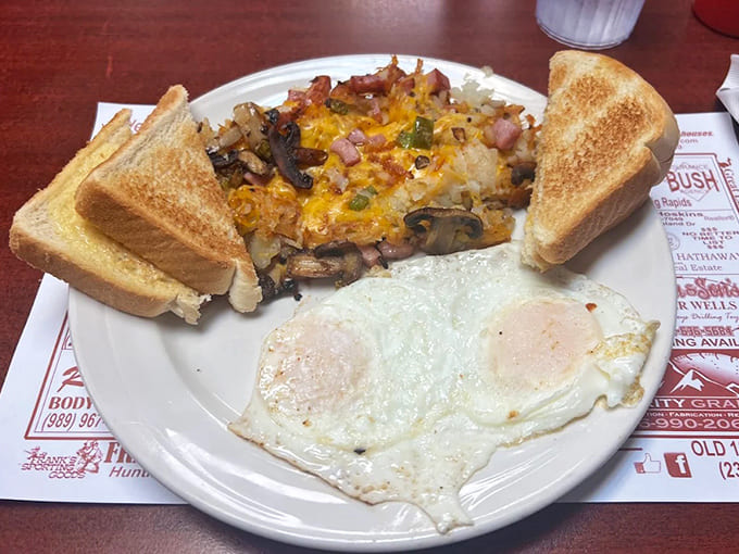 The breakfast skillet that makes hitting snooze worthwhile &ndash; a savory symphony of eggs, potatoes, cheese, and toast that fuels small-town America.