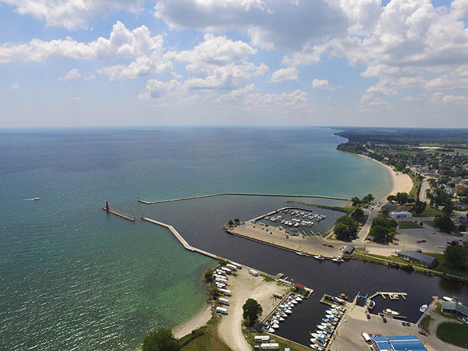 Algoma's stunning shoreline curves gracefully along Lake Michigan, where the harbor's protective arms cradle boats against nature's occasional fury.