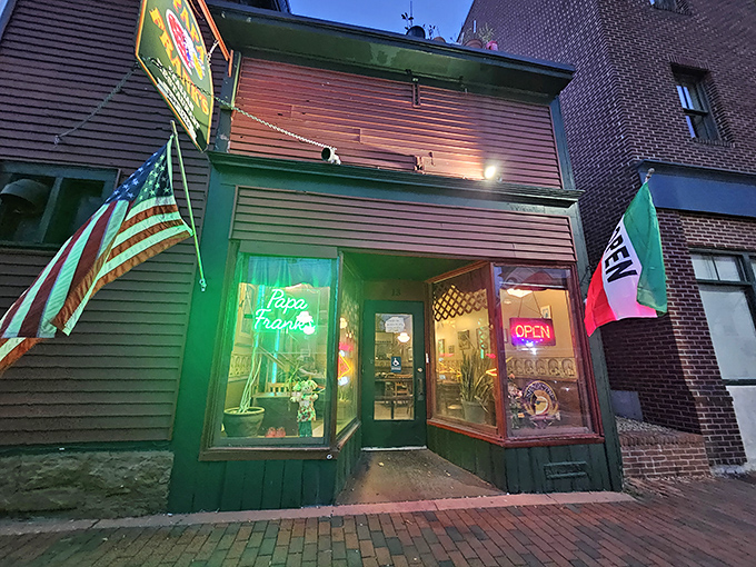 As evening falls, Papa Frank's glowing windows beckon like a lighthouse for the hungry souls of Winooski