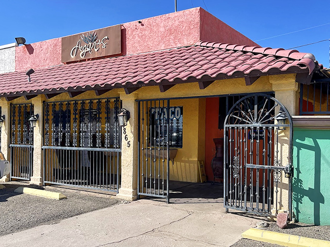 The exterior's cheerful yellow and terracotta palette promises the authentic experience that awaits inside this beloved Bullhead City institution.