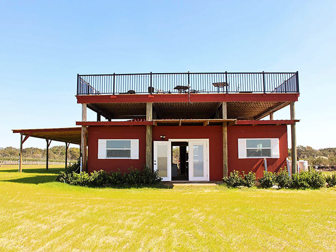 The farm's distinctive red building offers a perfect complement to the surrounding fields, with a rooftop deck for panoramic views.