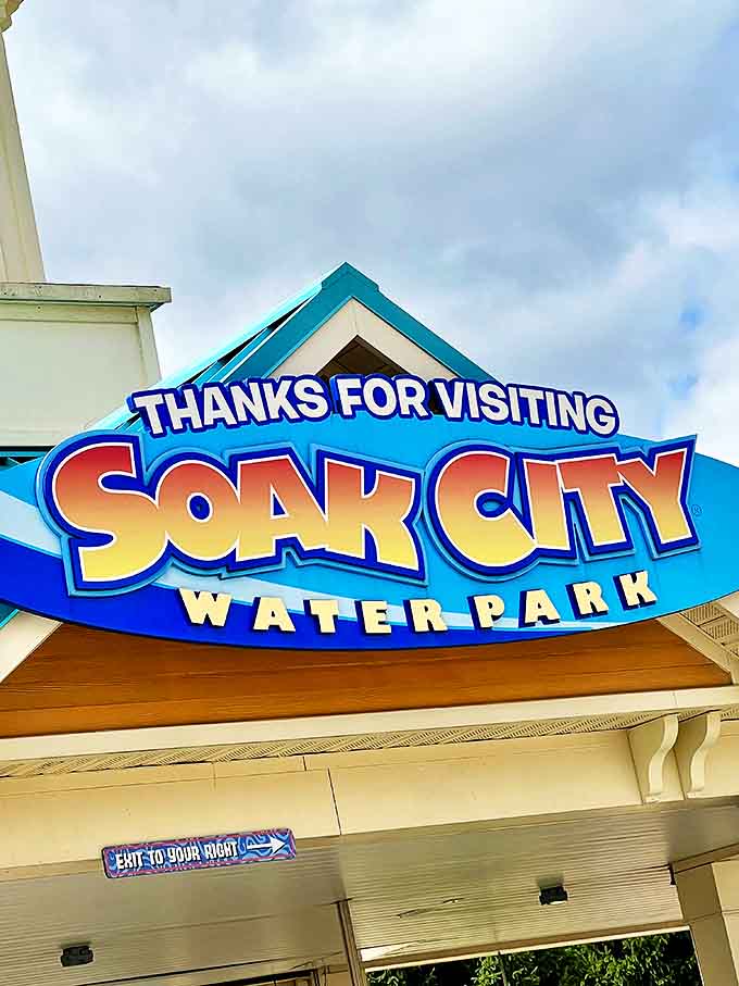 Sign: The bittersweet farewell sign that makes you immediately start planning your next visit while still dripping wet.