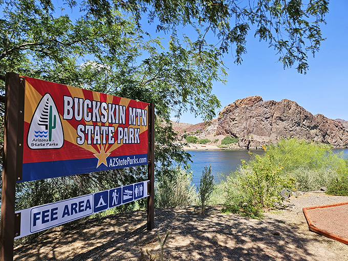 Morning tranquility at Buckskin Mountain, where the water mirrors the sky and time seems to stand perfectly still. Buckskin's welcome sign beautifully compliments the picturesque landscape.