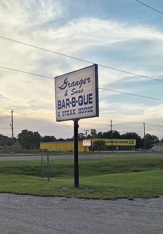 The sign that's launched a thousand detours. Simple, straightforward, and making promises that the kitchen absolutely keeps&mdash;in smoke and flavor.