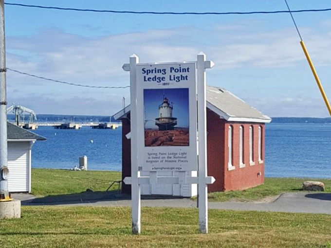 The welcoming sign tells visitors they've arrived at a special place, where maritime history is preserved through community dedication and volunteer spirit.