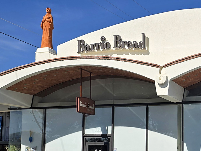 The iconic Barrio Bread signage against the desert sky, a beacon for carb-lovers and a symbol of Tucson's thriving artisanal food scene.