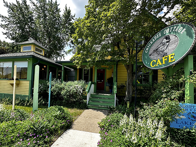 The iconic Chickadee Cottage sign welcomes hungry visitors with its cheerful green background and promise of culinary delights within.