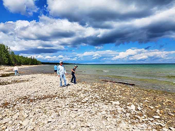Beachcombers explore Thompson's Harbor's rocky shore, where Lake Huron has been polishing stones to perfection since before humans invented Instagram.