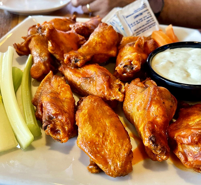 Wings that make you question why you ever settled for less. Crispy outside, juicy inside, and that ranch dressing is the perfect cool counterpoint.