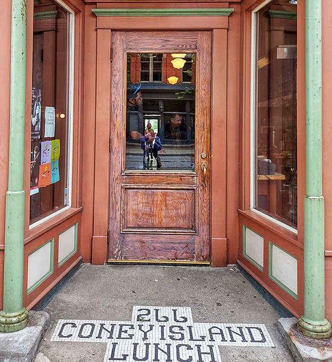 The iconic entrance with its mosaic "CONEY ISLAND LUNCH" threshold &ndash; a portal to simpler times and straightforward deliciousness that welcomes all who enter.
