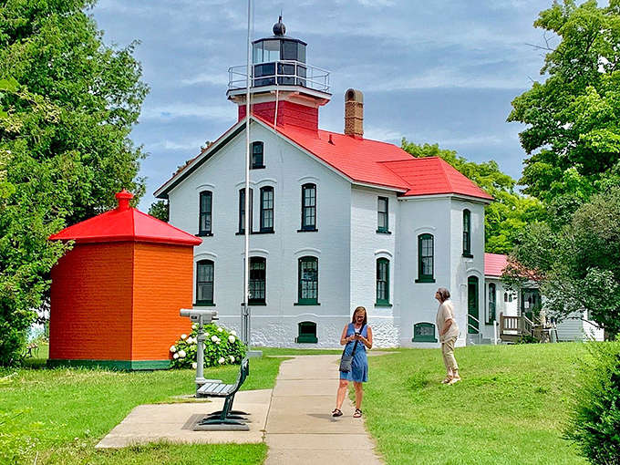 Visitors explore the grounds of the Grand Traverse Lighthouse, creating their own memories at this historic maritime landmark.