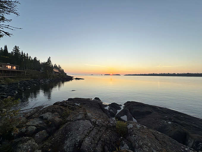 Golden hour transforms Lake Superior into a mirror of fire, proving that Isle Royale's most spectacular show happens daily at sunset.