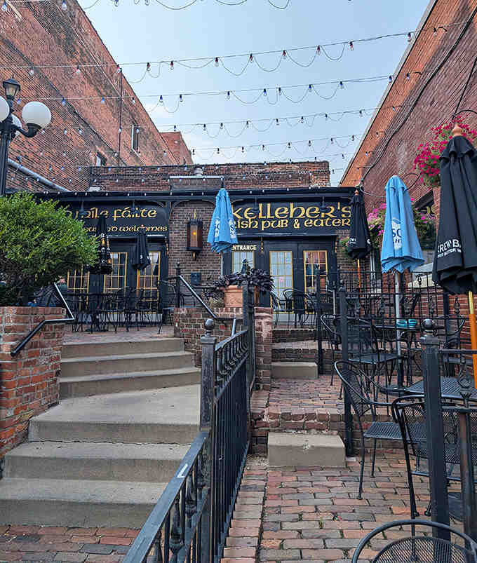 The outdoor patio beckons with string lights overhead and comfortable seating, creating an urban oasis perfect for lingering over pints on summer evenings.