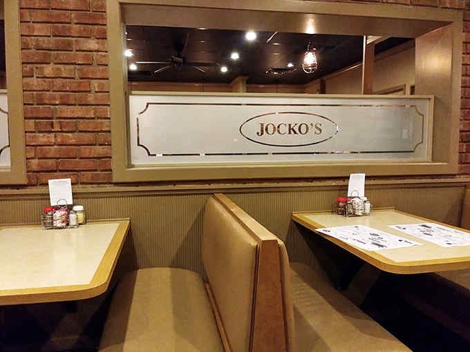 The cozy booths at Jocko's provide the perfect setting for enjoying their famous steaks surrounded by railroad history and small-town charm.