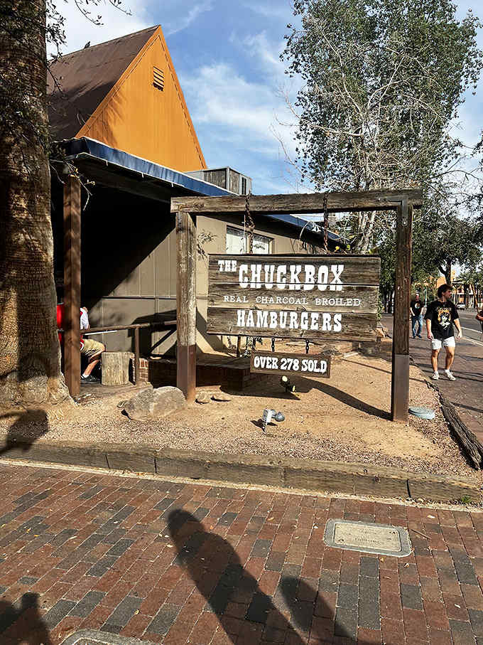 The Chuckbox's weathered wooden sign promises "REAL CHARCOAL BROILED HAMBURGERS" &ndash; a simple pledge that's kept burger lovers returning for decades.