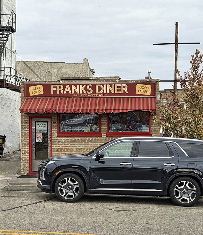 Frank's Diner's brick exterior with its cheerful red awning promises "Tasty Food" and "Good Coffee" &ndash; two promises it keeps with every meal served.