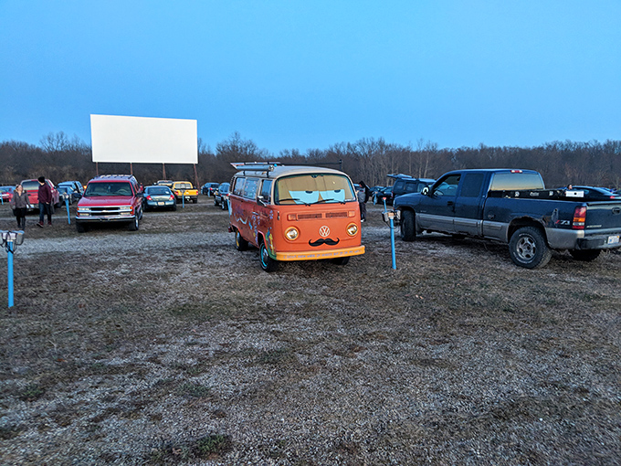 A classic orange VW bus takes center stage at Getty Drive-In, bringing retro vibes to movie night under Michigan stars.