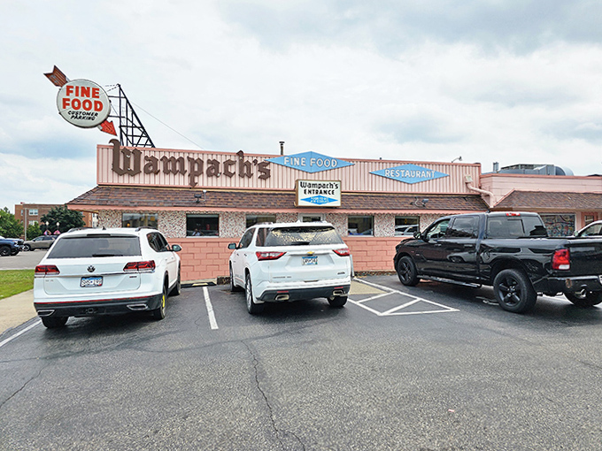 The classic roadside appeal of Wampach's Restaurant, complete with ample parking for hungry travelers seeking authentic Minnesota diner fare.
