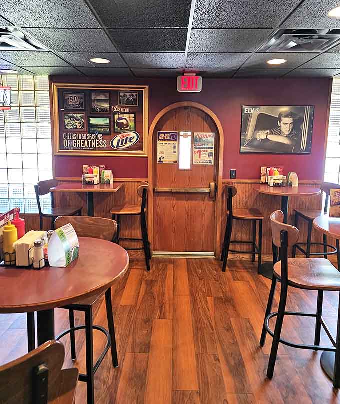 Warm wood paneling and burgundy walls create that perfect neighborhood tavern vibe, where conversations flow as freely as the beverages.