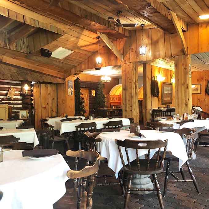 Inside, those soaring wooden beams and cozy lighting create an atmosphere that says "relax, you're among friends now."