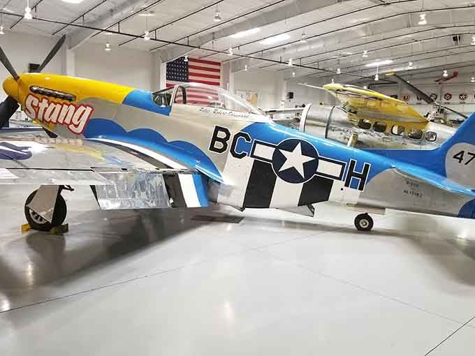 The P-51 Mustang gleams like a silver bullet, ready to relive its glory days as WWII's ultimate fighter.