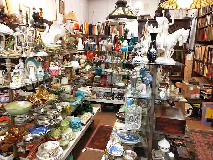 Step inside and witness the beautiful chaos of history &ndash; shelves bursting with porcelain treasures, glassware catching light, and figurines standing guard over decades past.
