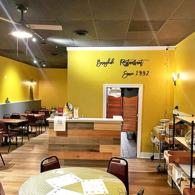 Bright yellow walls and wooden accents create a warm, inviting atmosphere that's been transporting diners to Thailand since 1992.