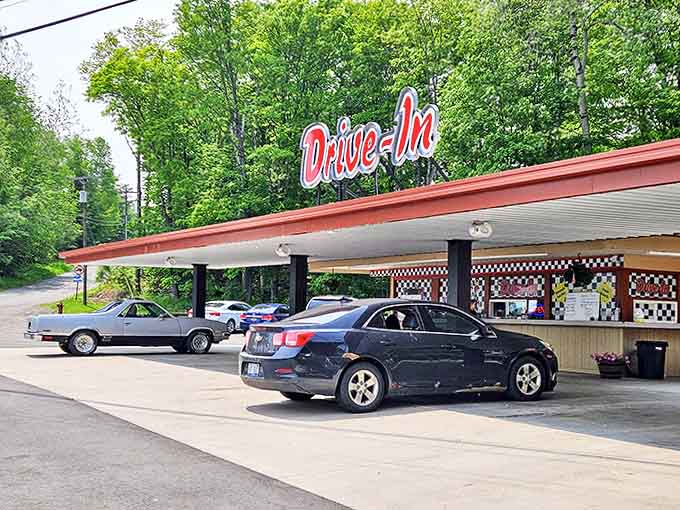 Classic cars and modern vehicles alike line up under the carport, where time seems to stand still while appetites grow.
