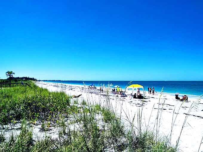Beachgoers enjoying their own slice of paradise. When personal space at the beach isn't a mathematical equation but a given.