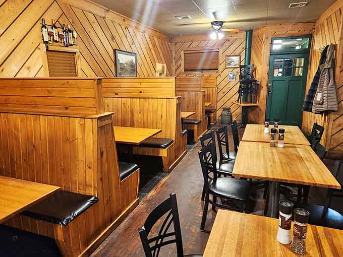 Warm wood paneling and cozy booths create an atmosphere where strangers become friends over exceptional meals.