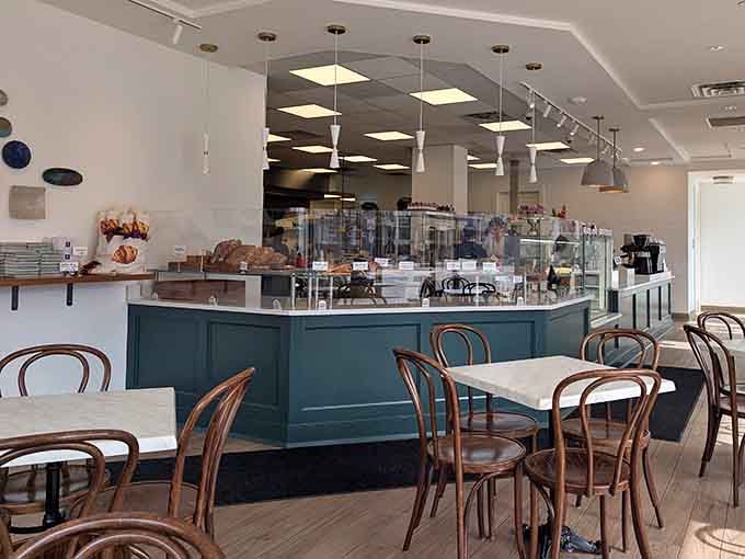 Clean lines and marble tables create a space where pastries get the gallery treatment they deserve.