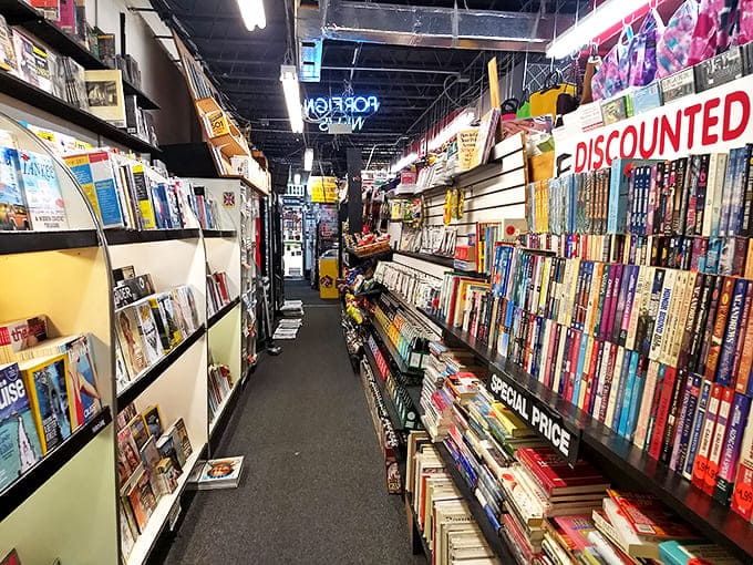 Narrow aisles create an intimate journey through literary treasures, where every turn promises new discoveries.