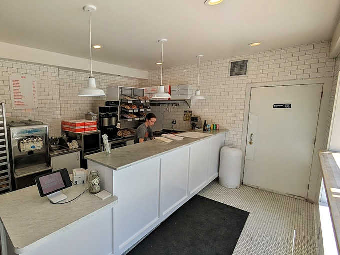 Clean white subway tiles and minimalist design keep the focus where it belongs—on the donuts. No distractions, just donut perfection.