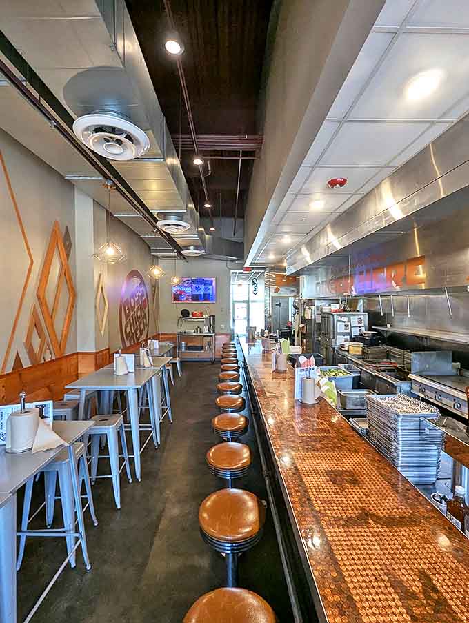 Counter seating that invites you to belly up to the bar of deliciousness – penny countertop gleaming with promises of flavor.