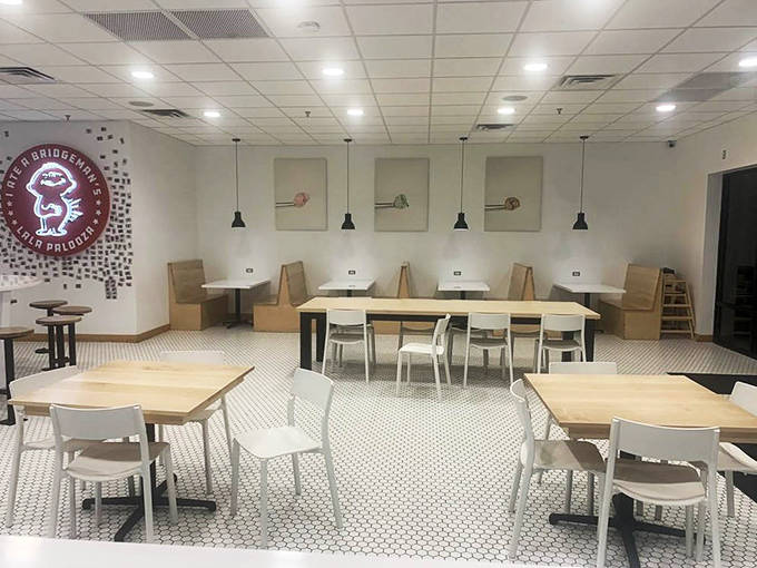 Clean lines, penny tile floors, and wooden booths create the perfect stage for ice cream drama to unfold. Simplicity never looked so inviting.