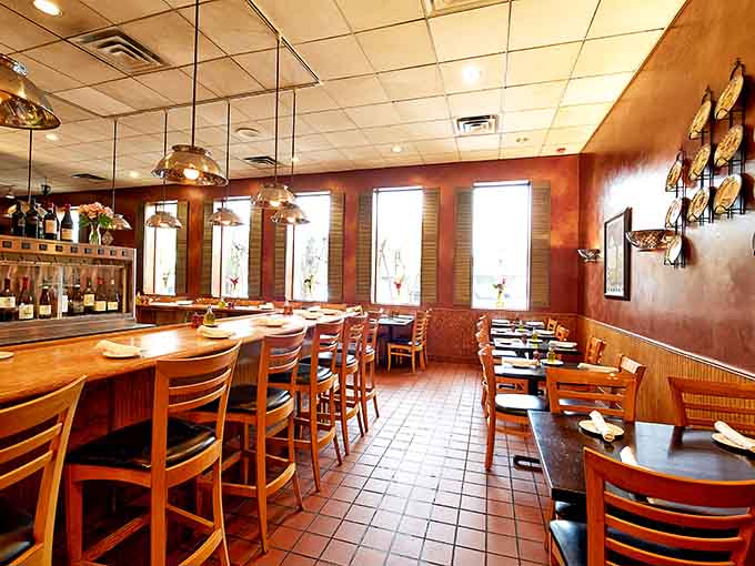 Warm wood tones and pendant lights create the perfect atmosphere for serious pasta consumption and questionable life decisions.