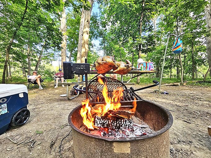 Nothing says "vacation accomplished" like roasting dinner over an open flame while woodland creatures judge your cooking skills.