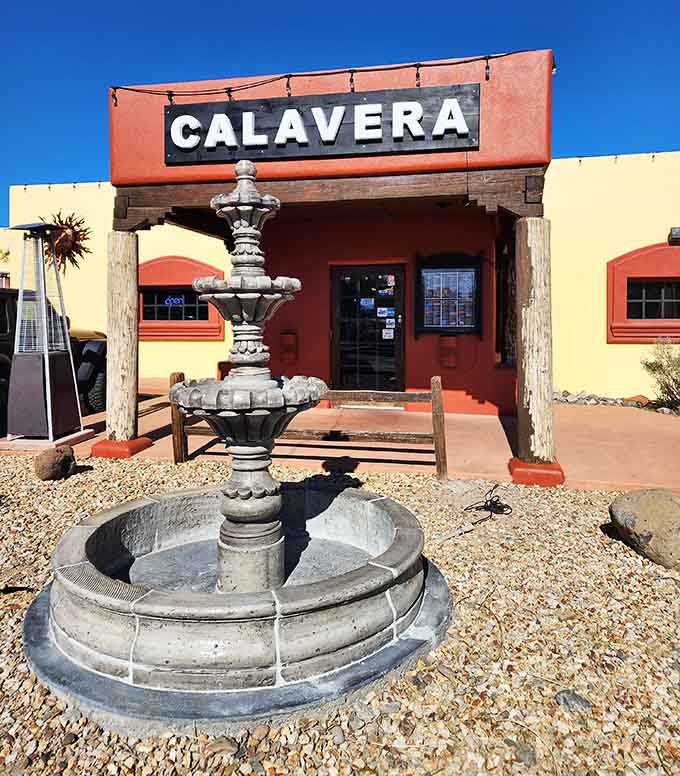 Calavera's fountain and colorful facade promise the kind of authentic experience that makes exploring small towns worthwhile.