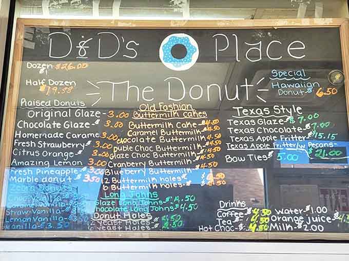 A chalkboard menu showcases D&D's impressive lineup, from classic glazed to their famous Texas-style fritters. The handwritten charm adds to the experience.