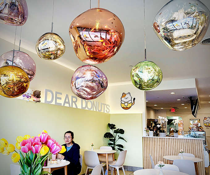 Those metallic pendant lights aren't just pretty, they're basically disco balls celebrating the fact that you're about to eat something amazing.