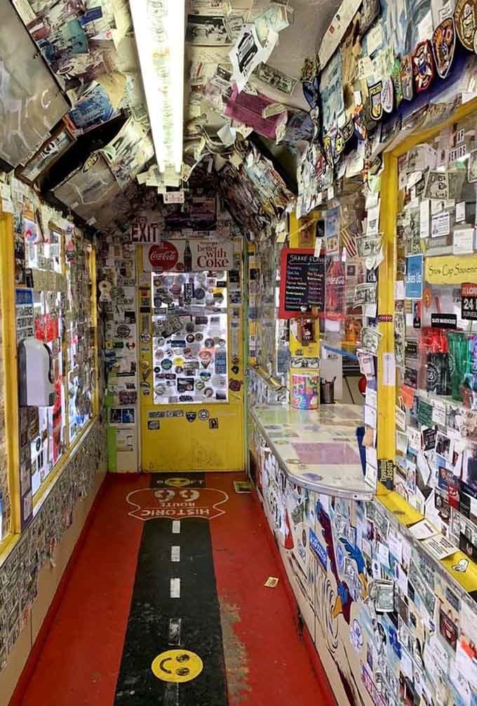 Every surface tells a story here, like someone turned a scrapbook into a restaurant and forgot to leave any blank spaces whatsoever.