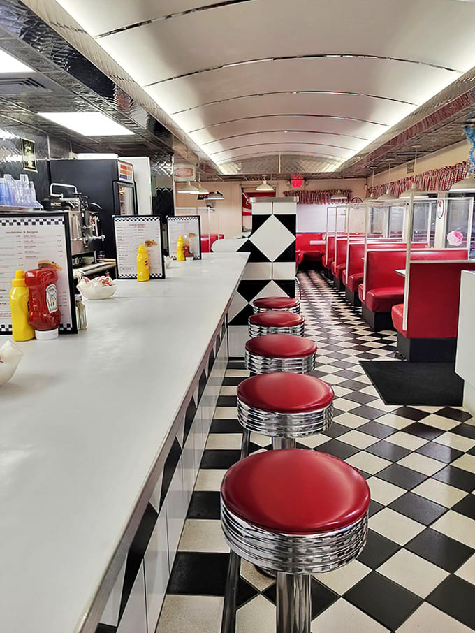 Step inside and travel back in time &ndash; the classic curved ceiling, checkered floor, and red vinyl booths create the quintessential American diner experience.
