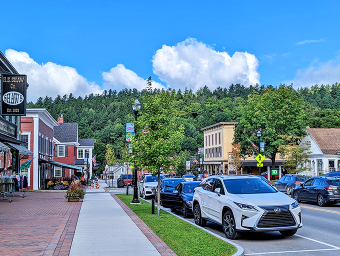 Brick sidewalks and charming storefronts invite leisurely exploration along Stowe's bustling downtown, where local shops reign supreme.