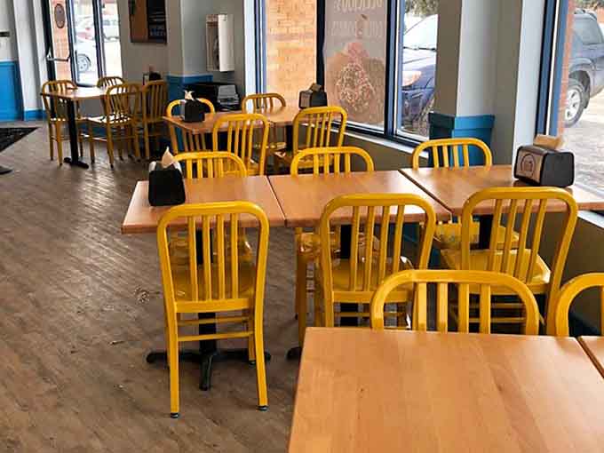 Bright yellow chairs and clean lines create the perfect stage for your donut drama to unfold.
