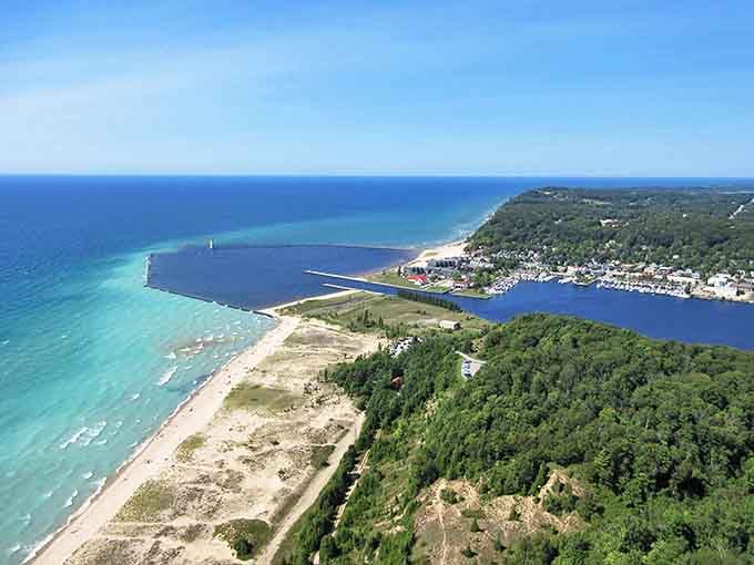 A bird's-eye view of Elberta Beach where Lake Michigan's turquoise waters meet golden shorelines, creating nature's perfect playground.