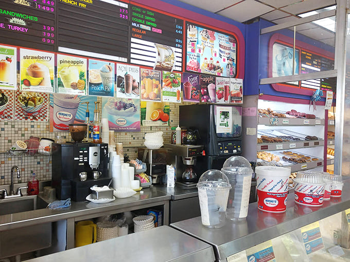 Behind the counter, a colorful menu board showcases everything from classic donuts to unexpected treasures &ndash; visual proof that decision-making isn't always easy.
